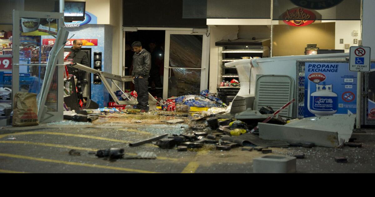 Three people injured after cars crashes into gas station kiosk