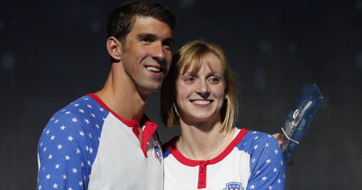 Michael Phelps lines up for Katie Ledecky's autograph