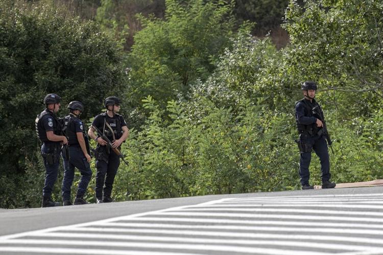 Kosovar police surround a village after Serb gunmen storm a monastery ...