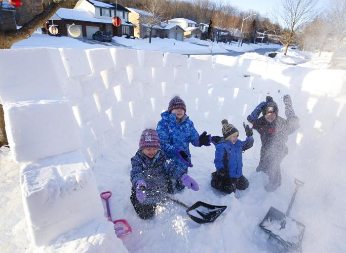 Photos: Siblings build giant snow fort in front of their Peterborough home