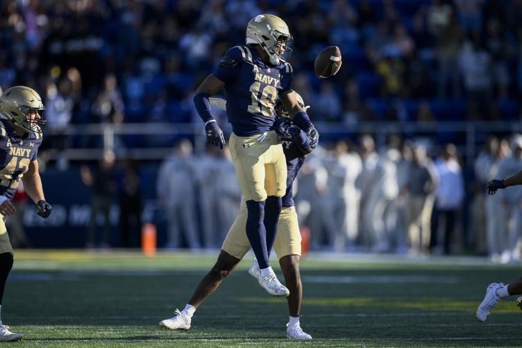 Peele returns 2 interceptions for TDs, No. 25 Navy overpowers Charlotte ...