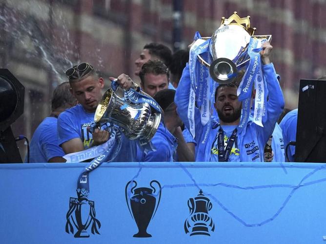 Manchester City celebrates winning treble of major trophies with open ...