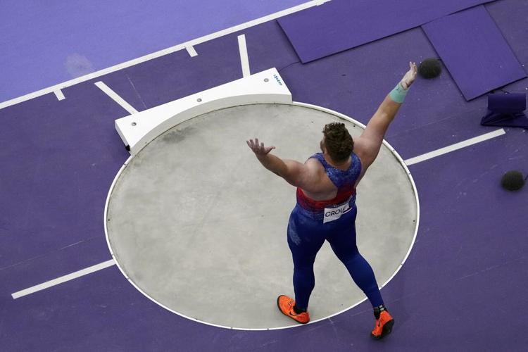 Ryan Crouser overcomes bothersome elbow to win 3rd straight Olympic ...