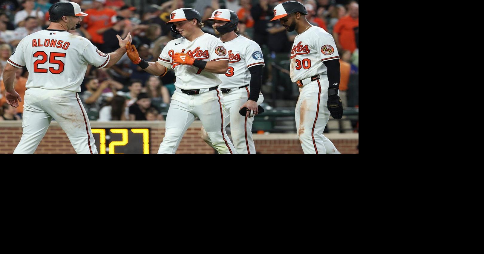 Holliday hits grand slam and Young pitches Orioles past Mariners 7-2 to ...