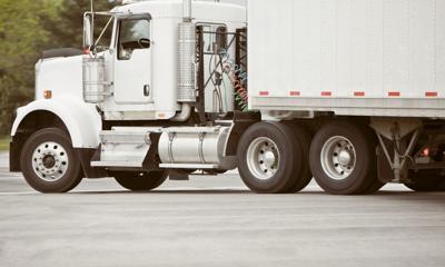 Truck turns right from the left lane, hits car: who is at fault?