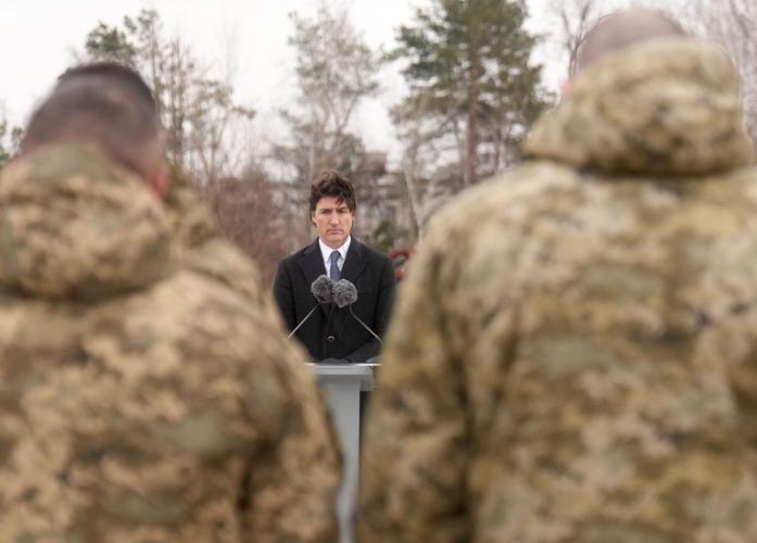 Trudeau signs support pact, attacks 'weakling' Putin in unannounced ...