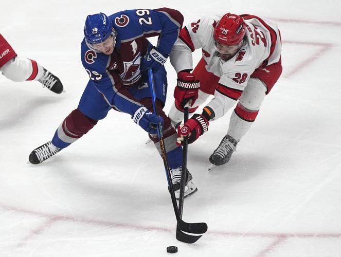 Avalanche score 5 goals in second period and end Hurricanes' 8-game win ...