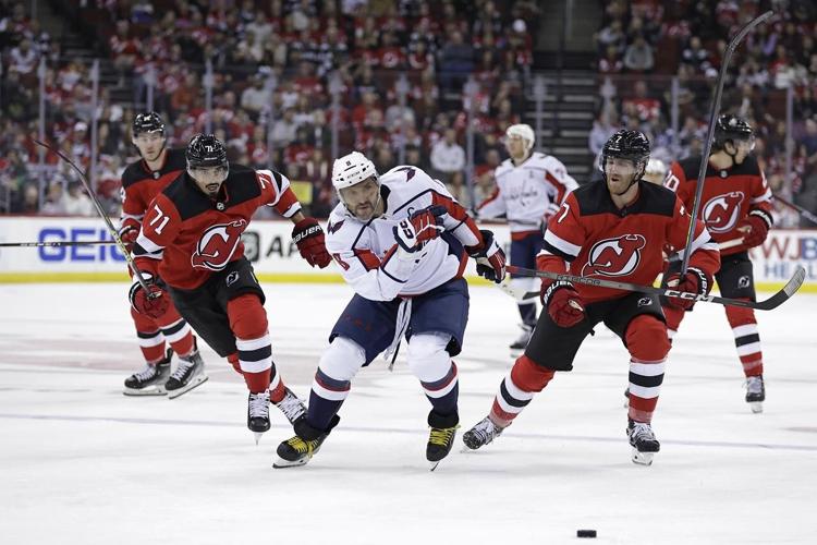 Capitals score three in third to rally for 6-4 win over Devils