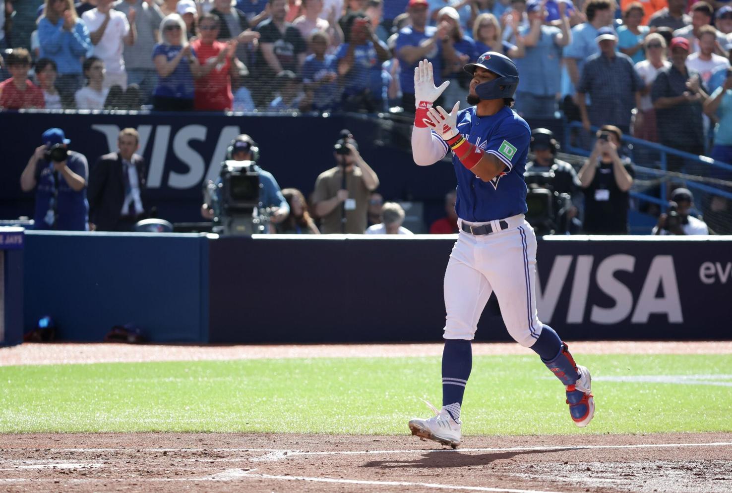 Blue Jays trade infielder Santiago Espinal to Reds for pitcher Chris ...