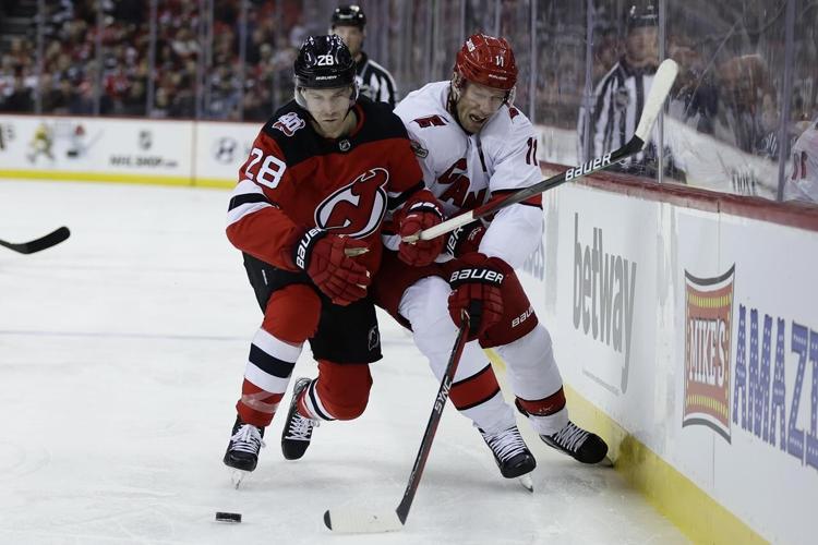 Hughes scores 1, sets up 2 by Bratt, Devils beat Canes 3-0