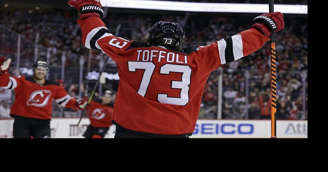 Capitals score three in third to rally for 6-4 win over Devils