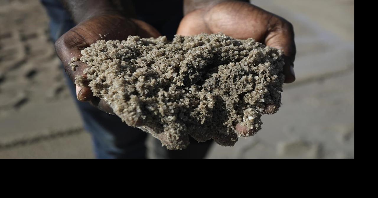 As sand miners prosper in Uganda, a vital lake basin suffers