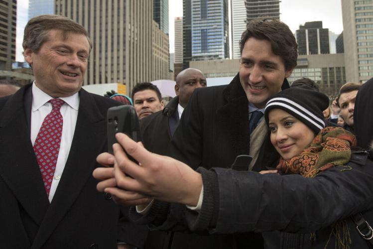 Cheering fans, angry cabbies greet Prime Minister Justin Trudeau
