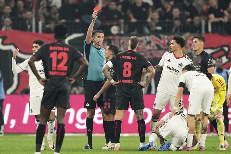 Leverkusen fights past in-form Frankfurt to earn first Bundesliga win