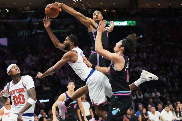 Heat survive frantic rally at the buzzer to edge the Knicks 115-113