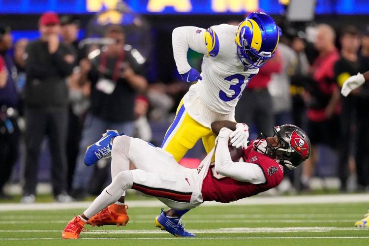 Stafford and Adams connect for 2 more TDs while NFC-leading Rams roll to 34-7 win over Buccaneers