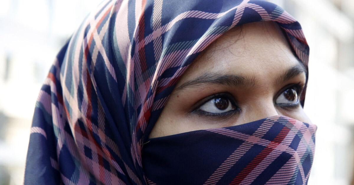 Talk to the veiled woman and let her decide