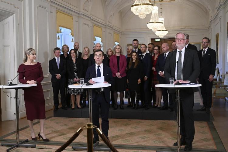 New Swedish PM presents 3-party center-right government
