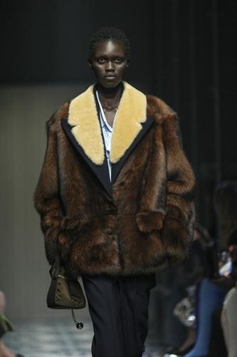 Prada reconstructs femininity starting with the little black dress fit ...