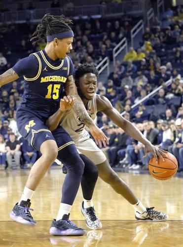 Tre Donaldson scores 7 during Michigan's game-closing 9-0 run for a 76 ...