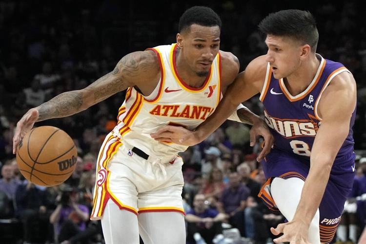 Devin Booker scores 30 points, Suns get hot from 3-point range to beat Hawks 128-115