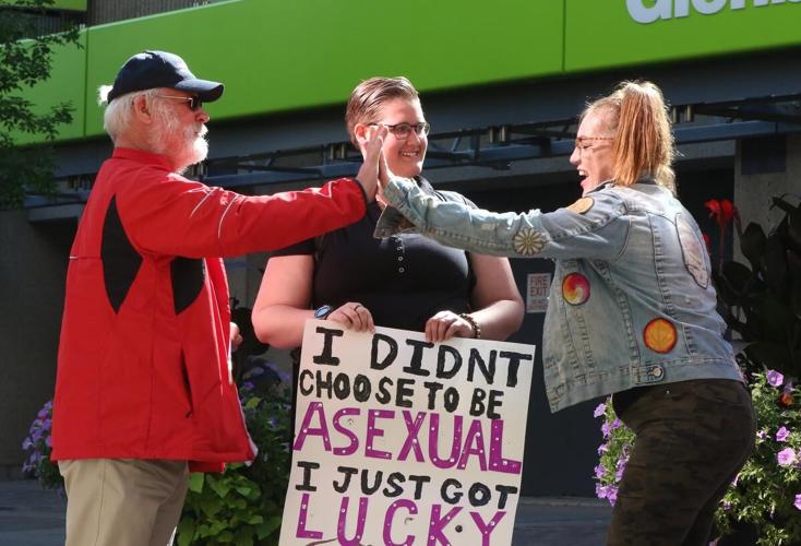 LGBTQ supporters protest Billy Graham Association presence in Calgary ...