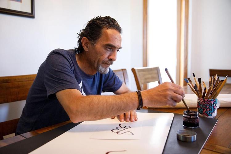 Syrian artist mixes messages of hope with Arabic calligraphy for ...
