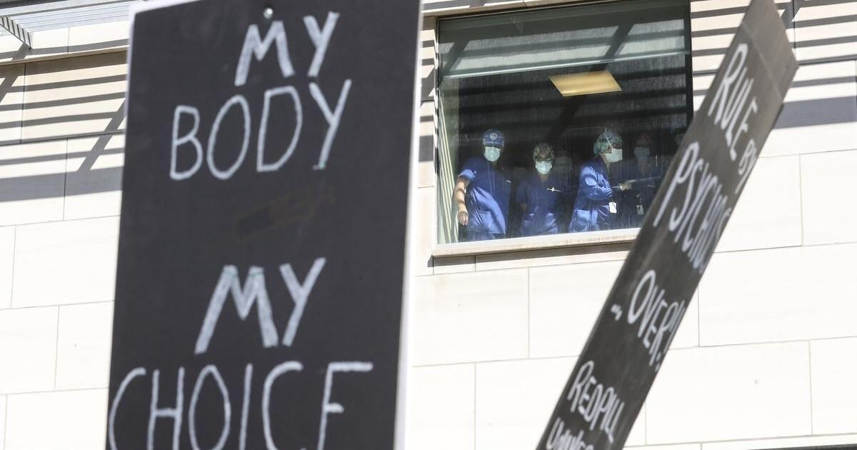 Front-line doctors fighting on two fronts: a deadly pandemic and ...