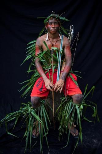AP PHOTOS: Amazon’s Tembe paint bodies for rituals and war