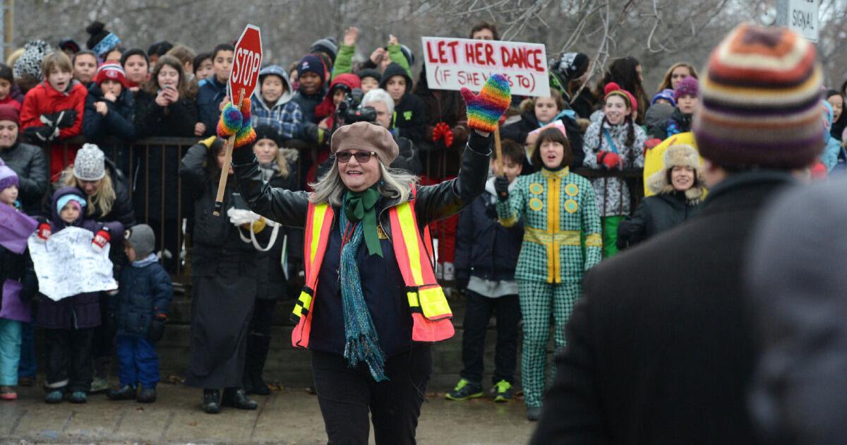 Dancing crossing guard's supporters rally at crosswalk