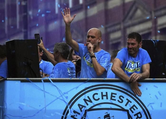 Manchester City celebrates winning treble of major trophies with open ...
