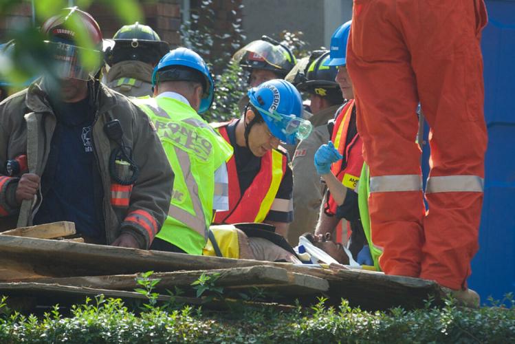 One dead, two injured after house collapse traps workers
