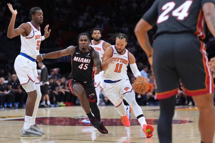 Powell scores 29 as Heat beat Knicks 115-107 in Miami's home opener