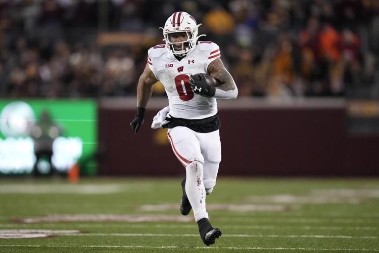 Badgers beat Gophers 28-14 to take back Paul Bunyan's Axe behind Allen ...