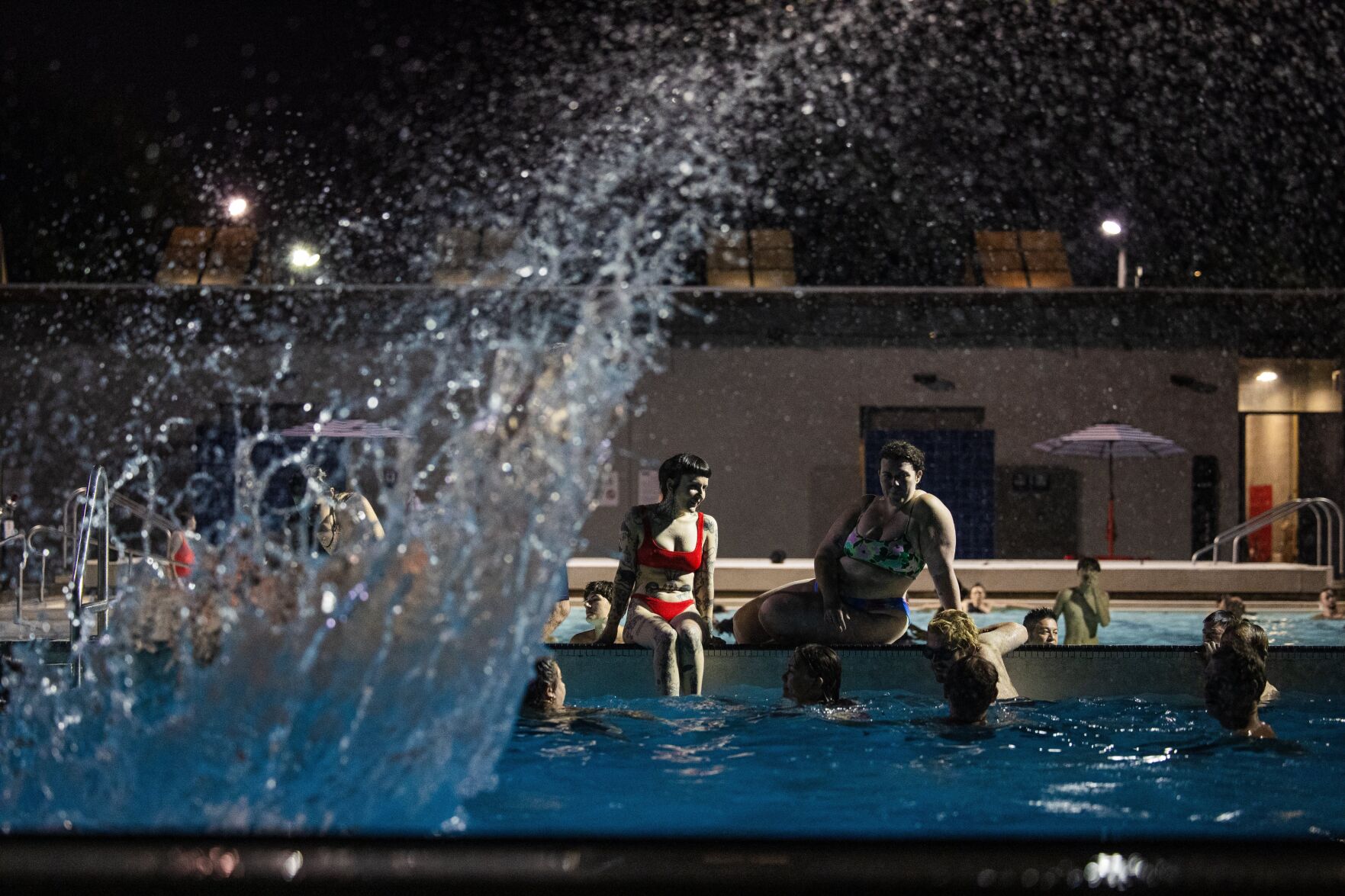 Night swimmers beat the heat at select Toronto pools