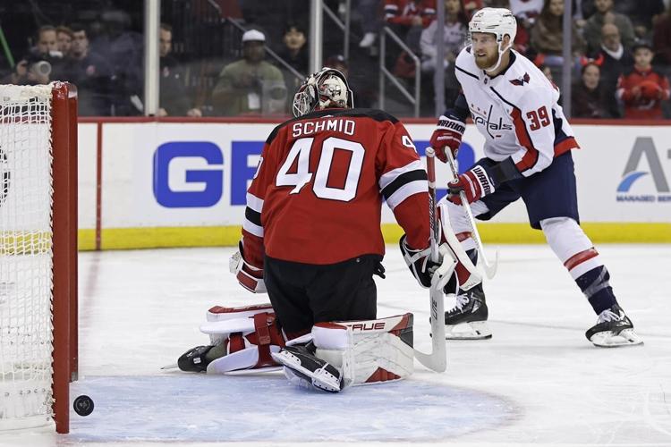 Capitals score three in third to rally for 6-4 win over Devils