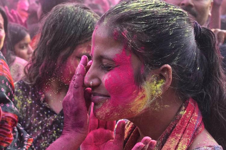 Photos of revelers celebrating Holi, the Hindu festival of colors, in ...