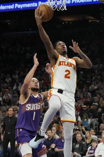 Devin Booker scores 30 points, Suns get hot from 3-point range to beat Hawks 128-115