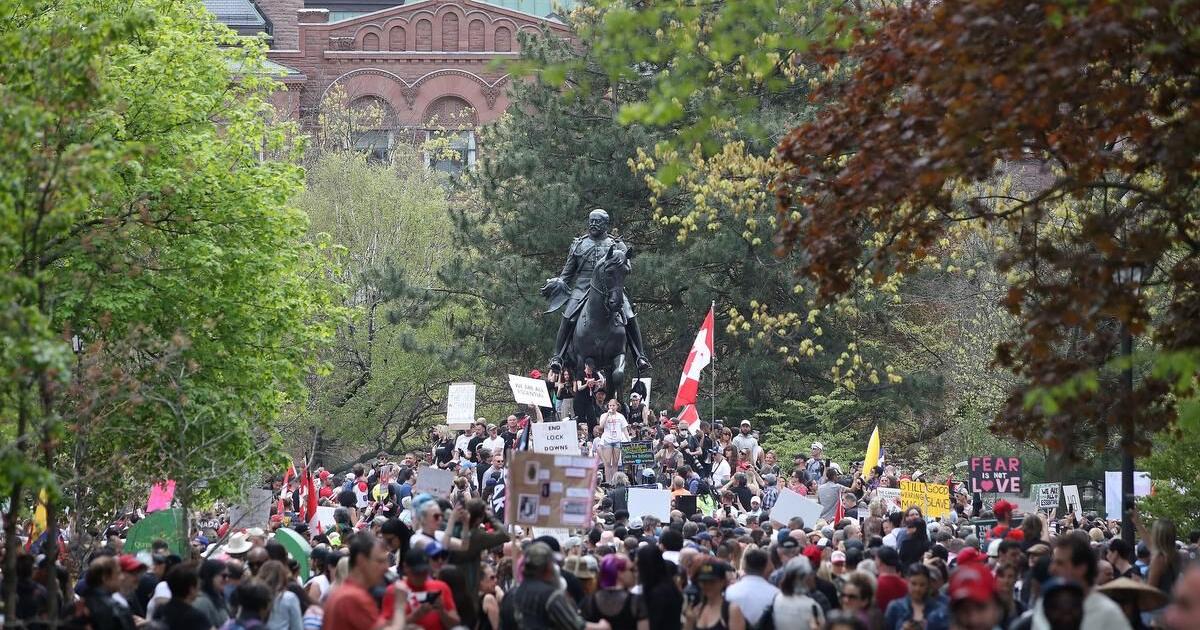 Charges laid at two massive protests in downtown Toronto on Saturday