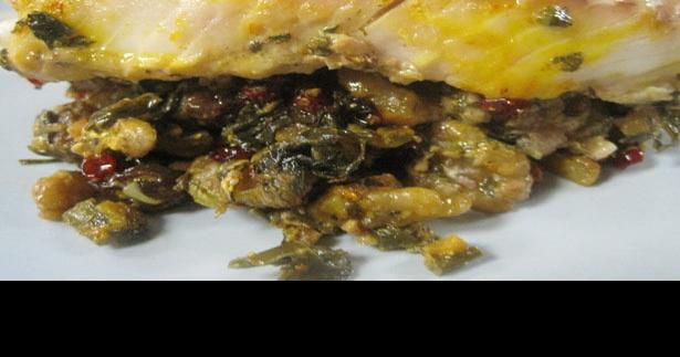 Baked fish with nuts, dried fruit and herbs