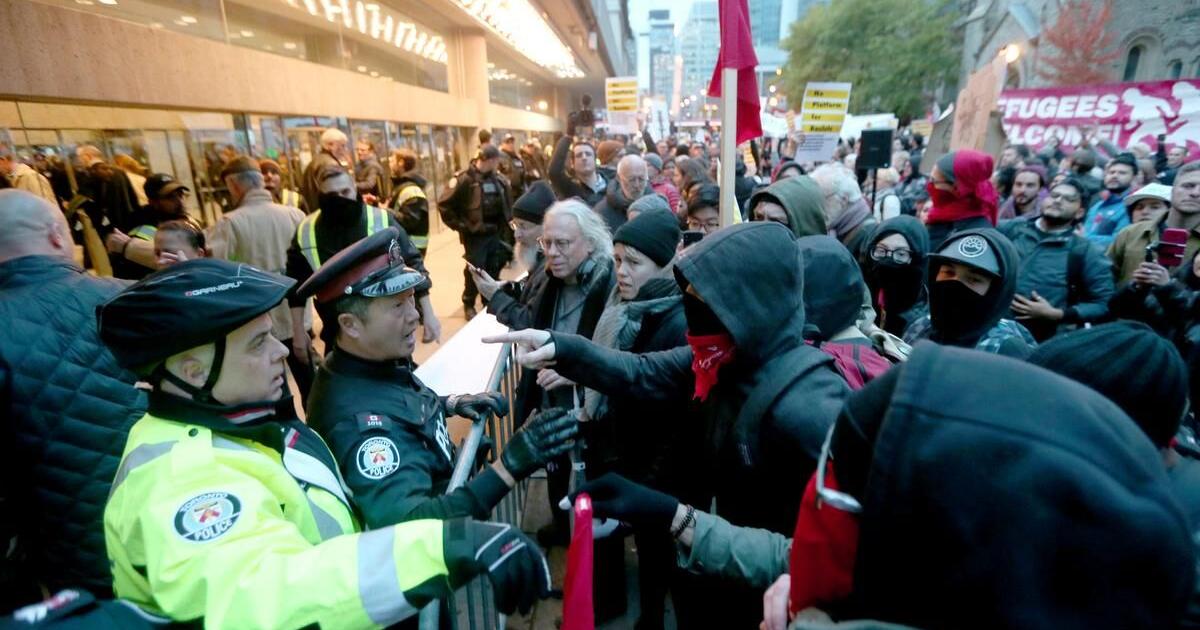 Twelve arrested, two police officers injured following protests at Munk ...