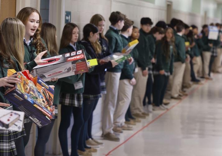 Feehan students form human toy chain for annual Santa Shop | Gallery ...