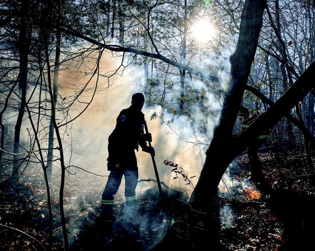Crews from several communities battle brush fire along Foxboro train ...