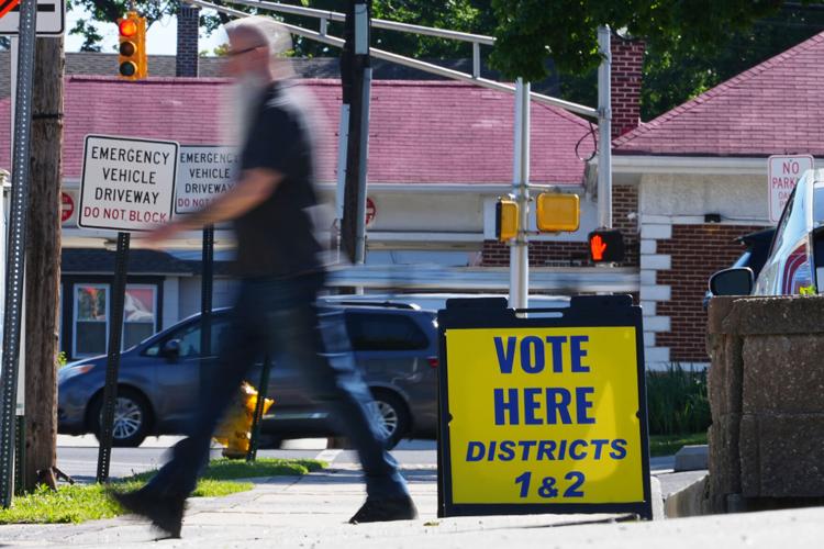 The Latest: Polls open for races across the US as a busy primary ...