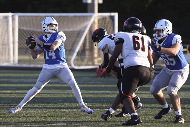H.S. FOOTBALL: Bombardiers hit on all cylinders to race past Black ...