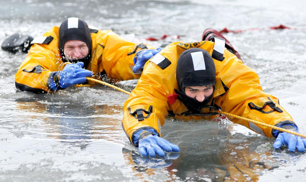 Taking the plunge: Area firefighters practice ice rescue skills | Local ...