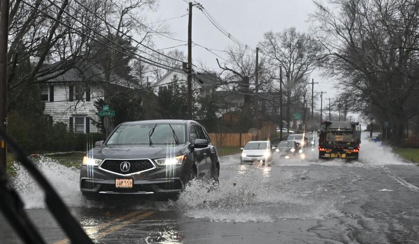 Heavy rain and high winds knock out power, downs trees, close roads in ...