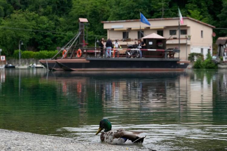 Italian commuters find a moment of peace on a cable-guided ferry ...