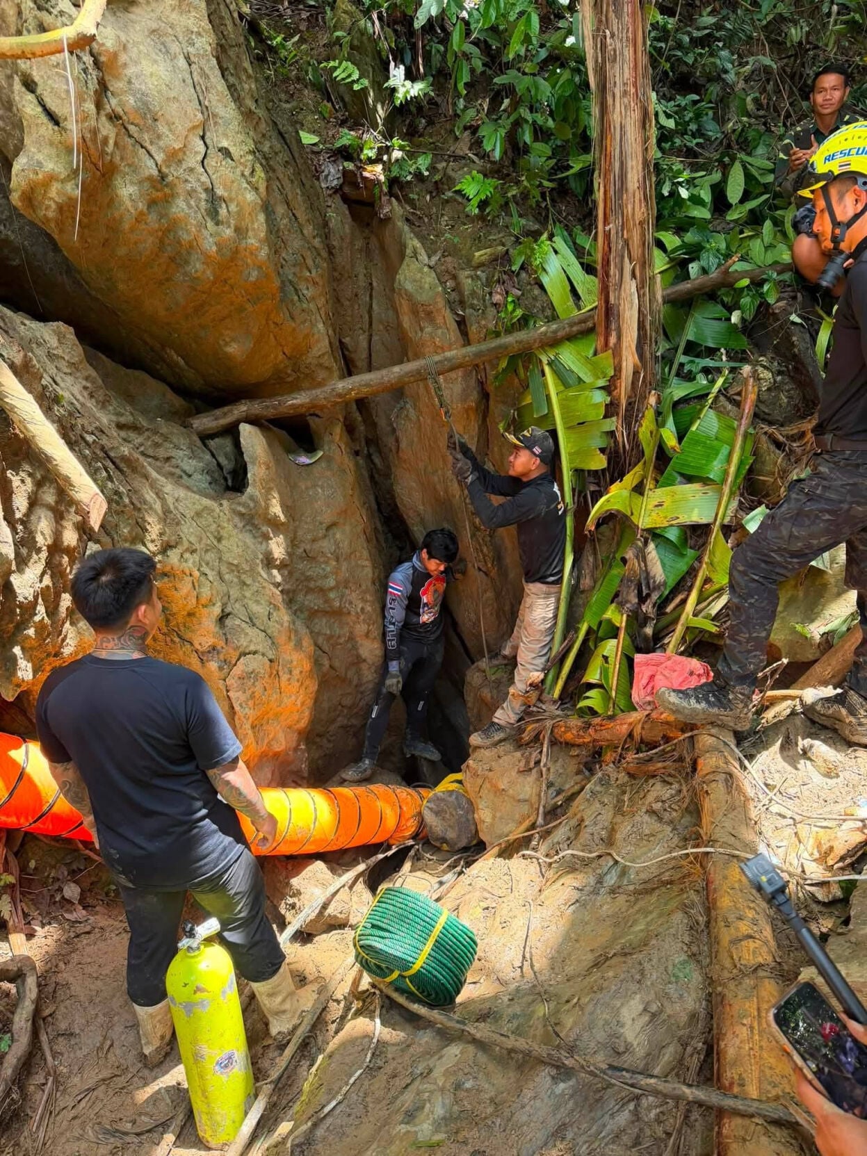 Search continues for 7 villagers trapped in a flooded cave in Laos ...