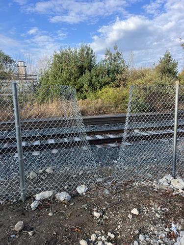 New fencing along Foxboro commuter rail station tracks cutting off foot ...